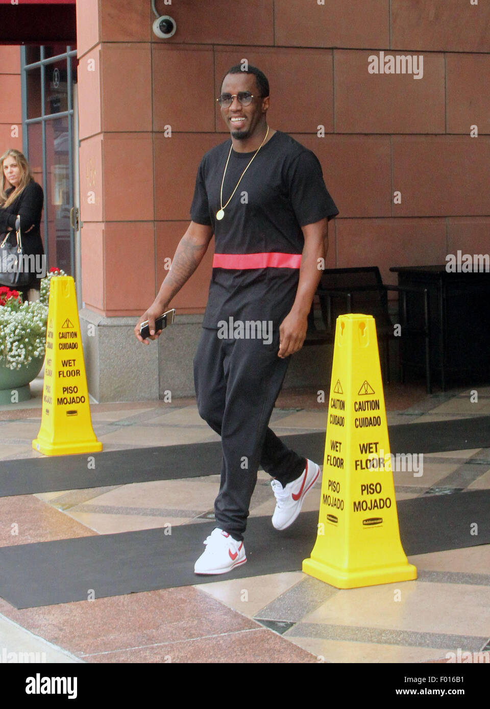Sean Combs is all smiles as he leaves an office in Beverly Hills ...