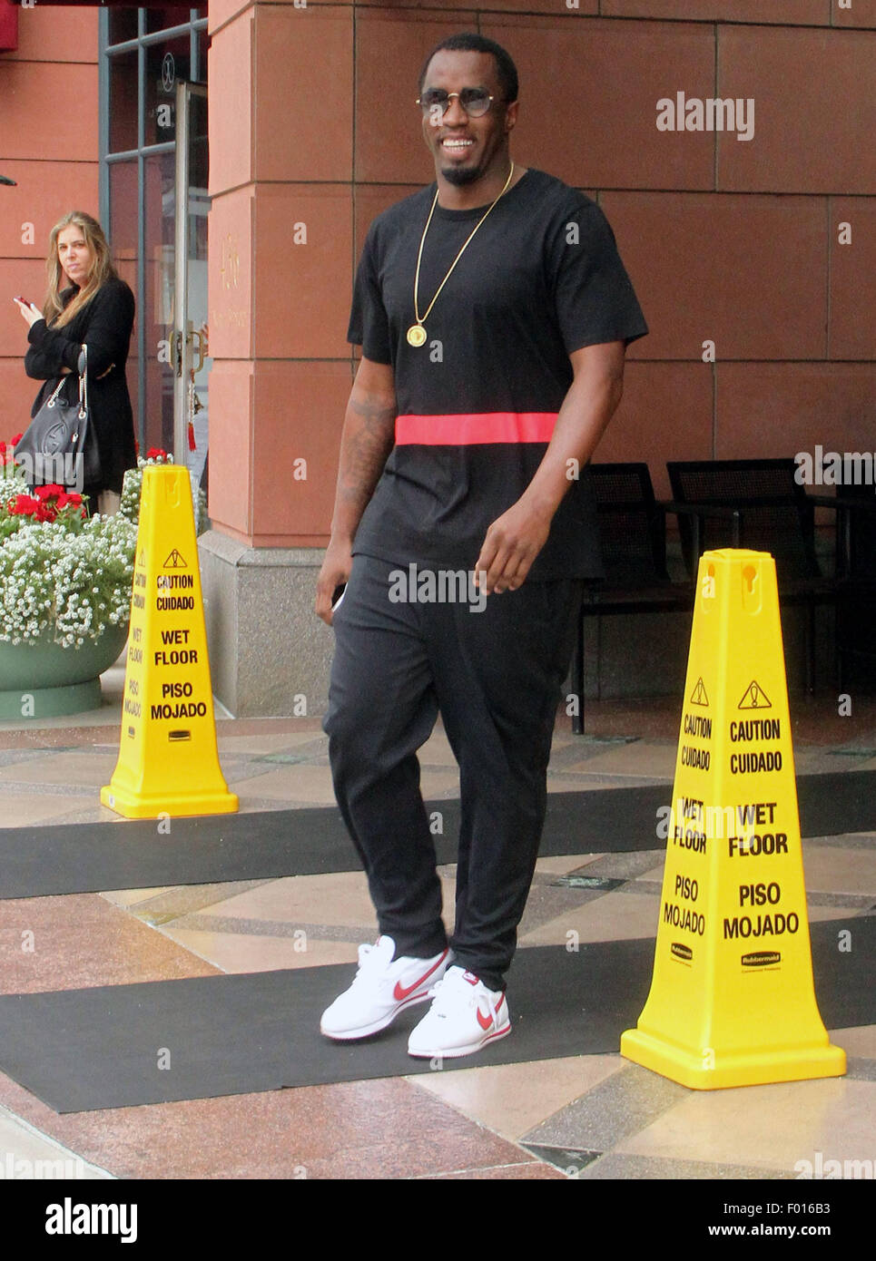 Sean Combs is all smiles as he leaves an office in Beverly Hills ...