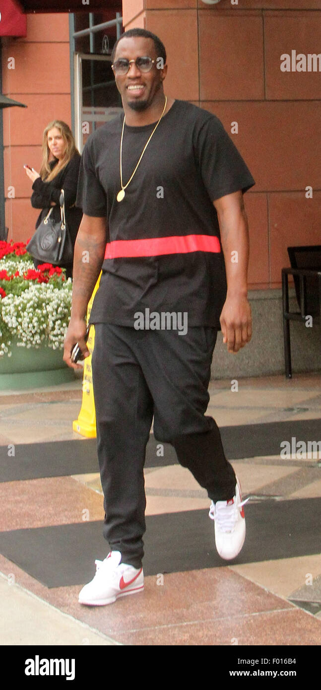 Sean Combs is all smiles as he leaves an office in Beverly Hills ...