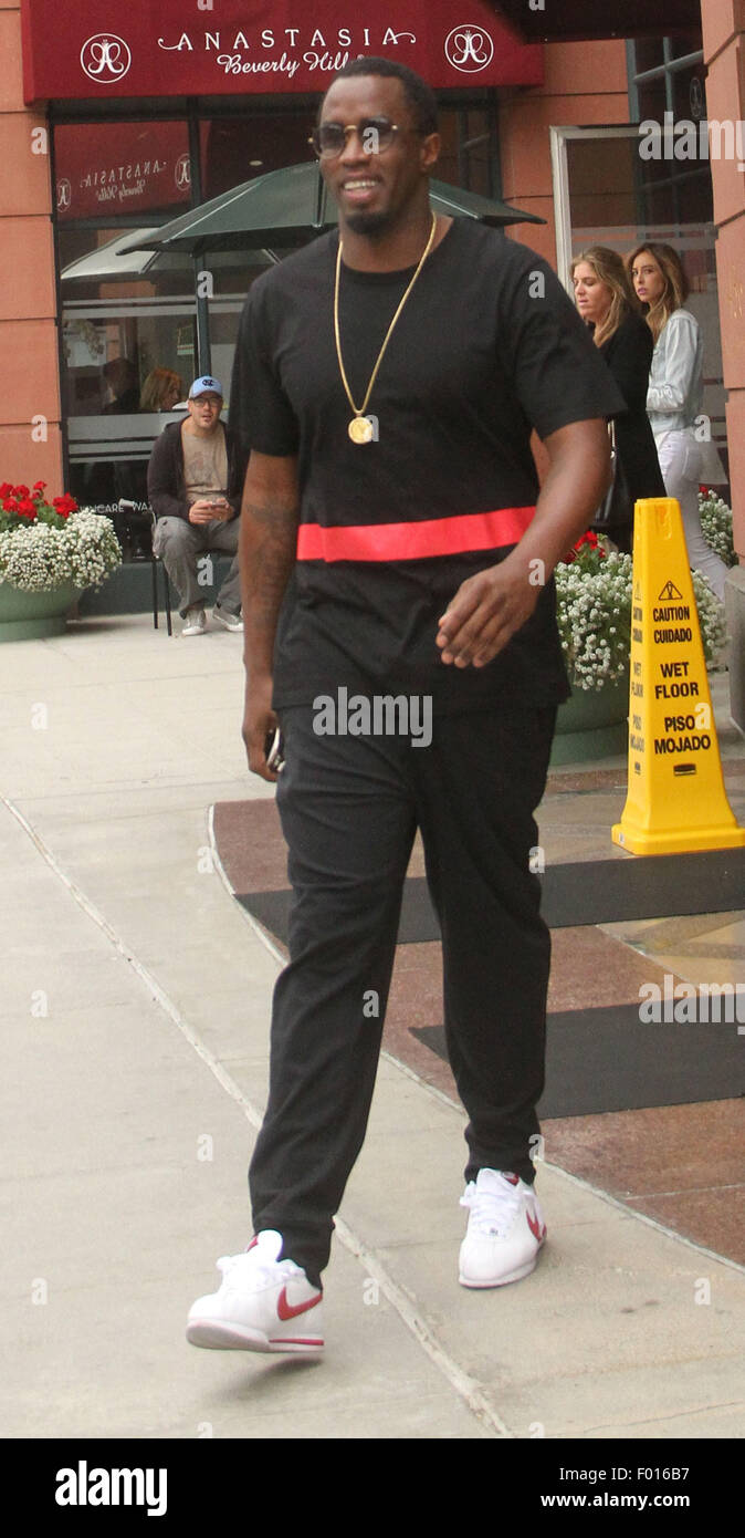 Sean Combs is all smiles as he leaves an office in Beverly Hills ...