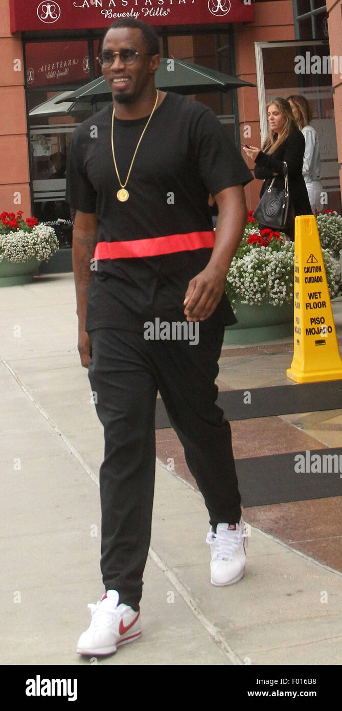 Sean Combs is all smiles as he leaves an office in Beverly Hills ...