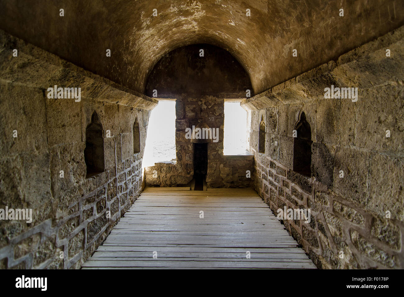 Historic stone room in an ancient building with arched windows and ...