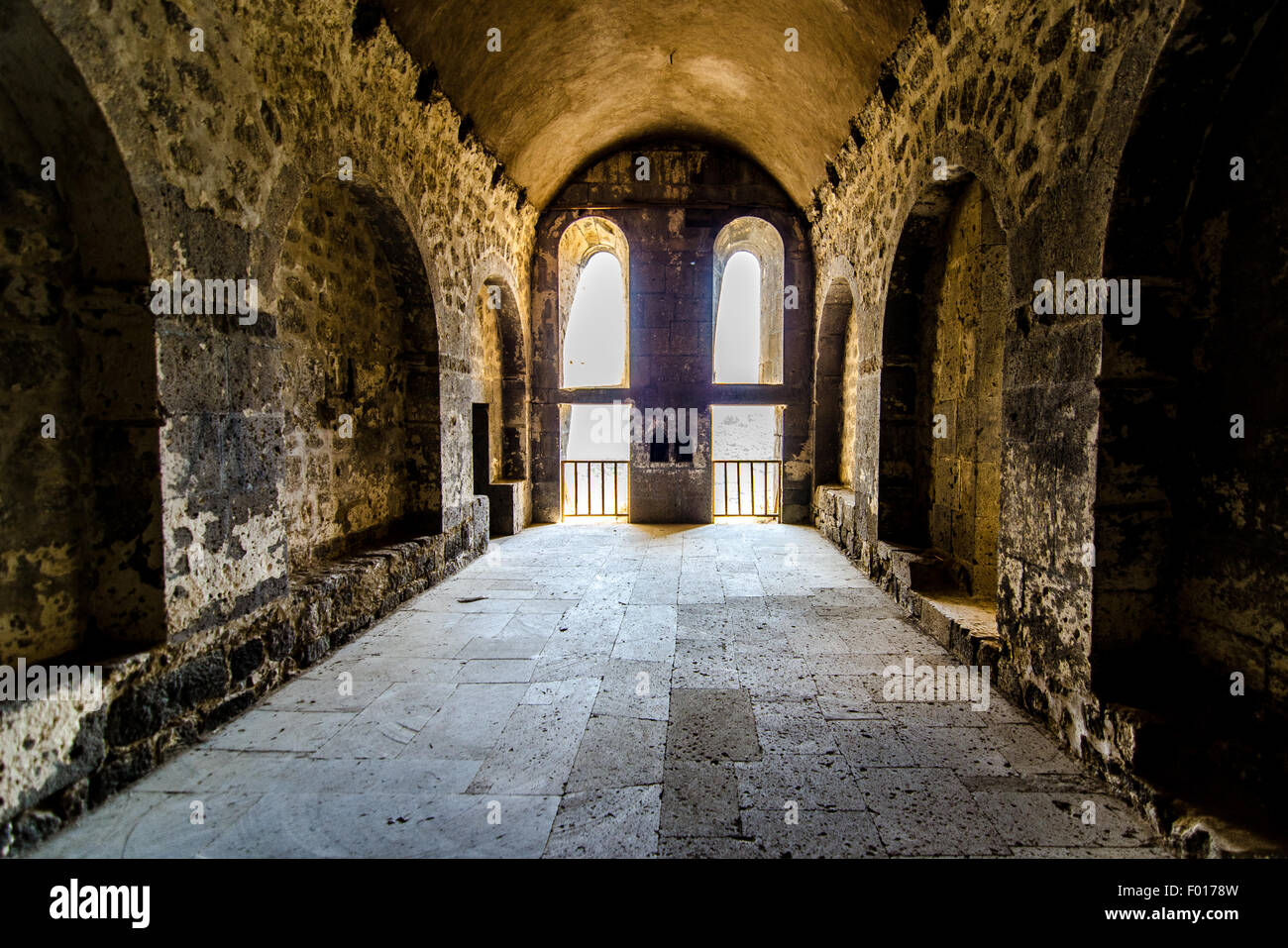 Historic stone room in an ancient building with arched windows and ...