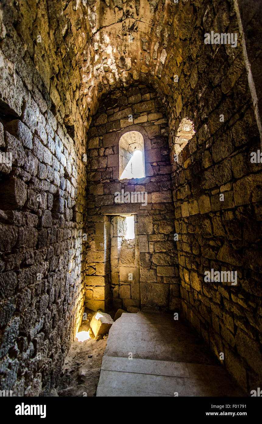 Historic stone room in an ancient building with arched windows and ...