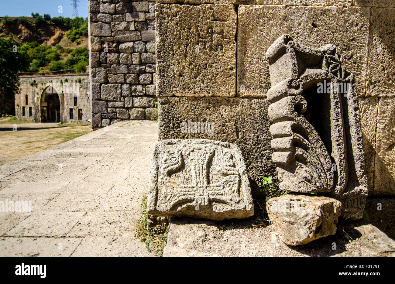 Historic stone monastery in a serene landscape under a clear blue sky ...