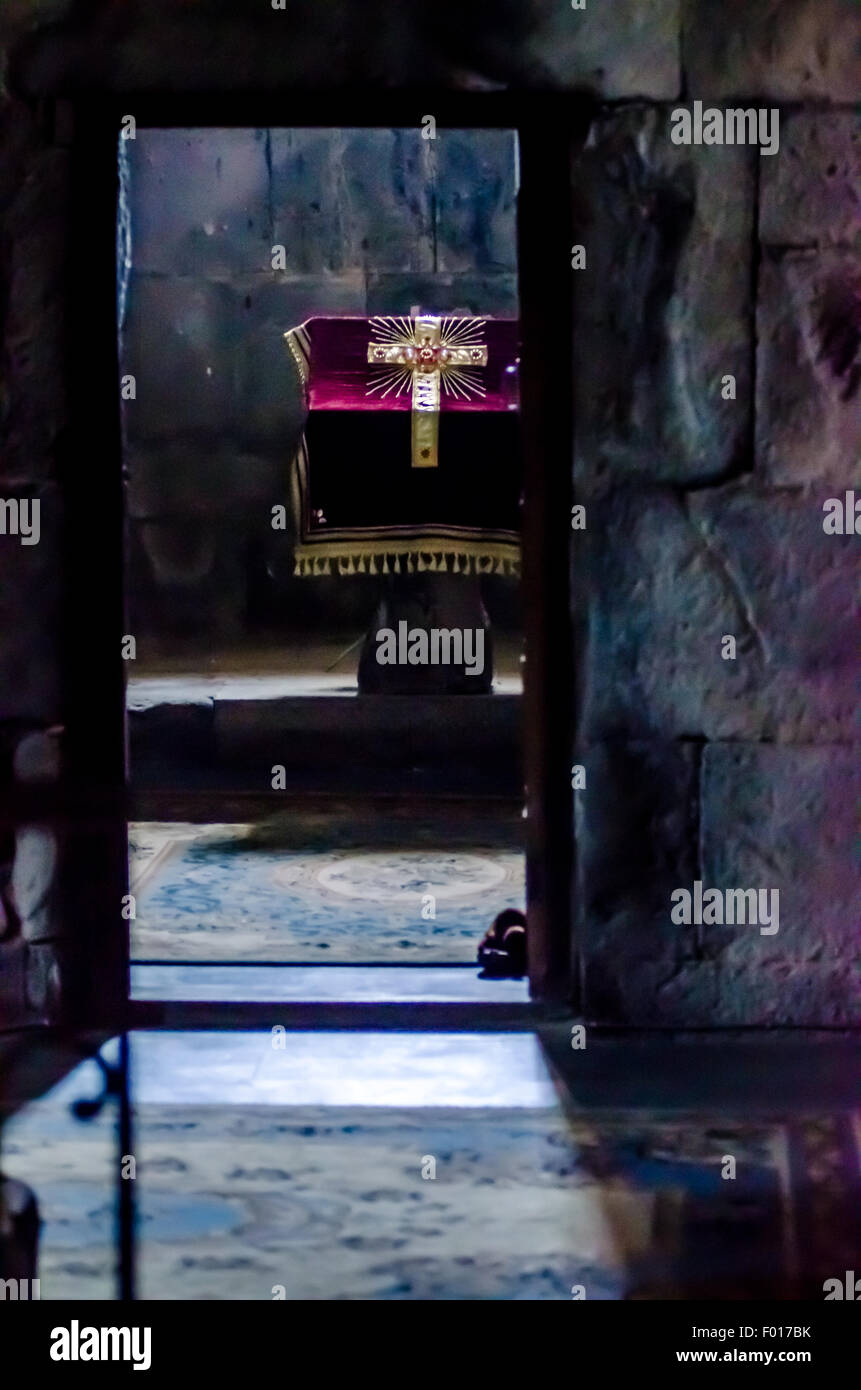 Ancient altar adorned with intricate designs captures sacred light in a ...