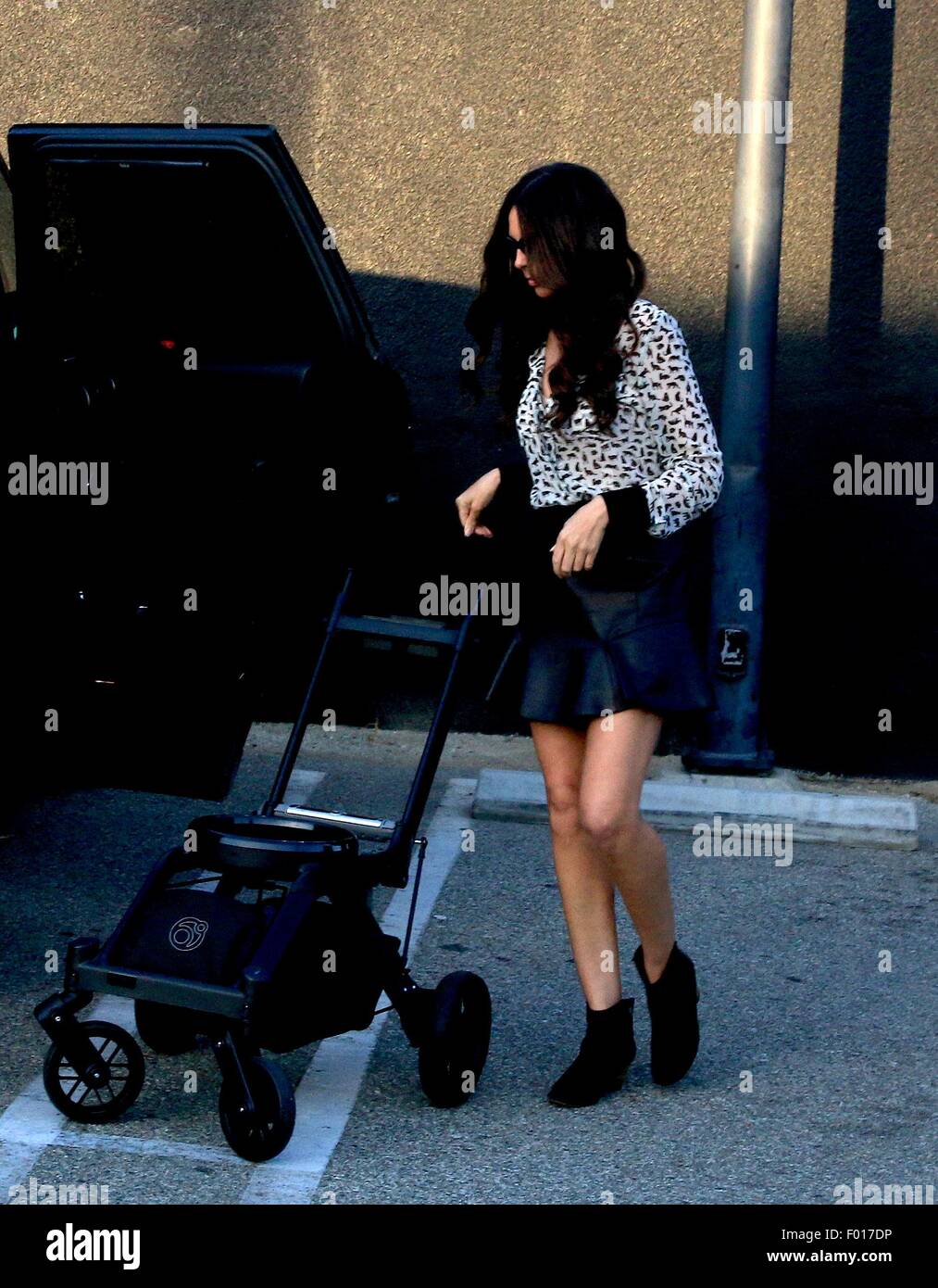 Terri Seymour wearing a very short black leather skirt showing off her ...