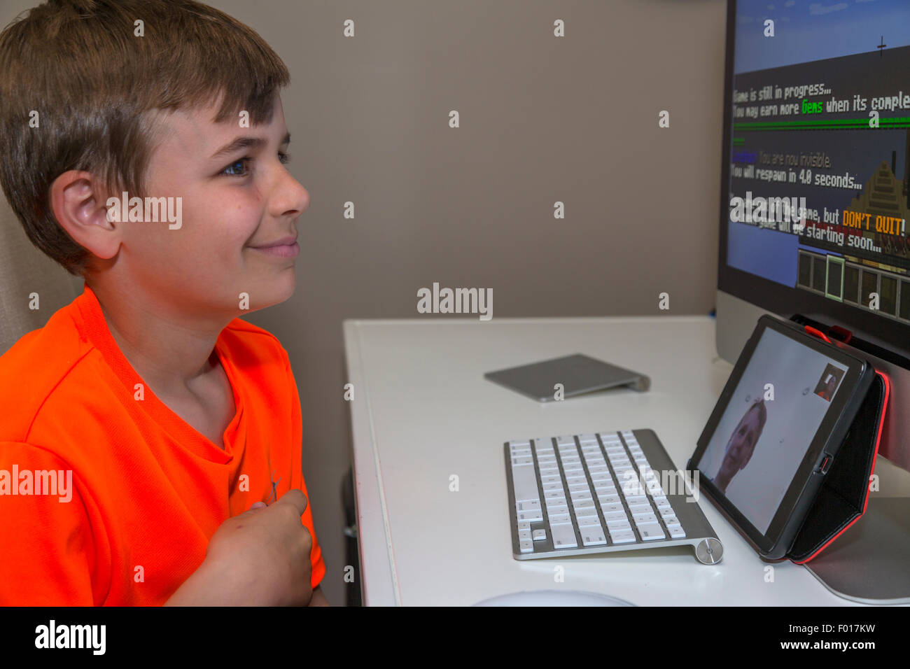 Two Young Boys Play Video Games at Long Distance, Communicating via ...