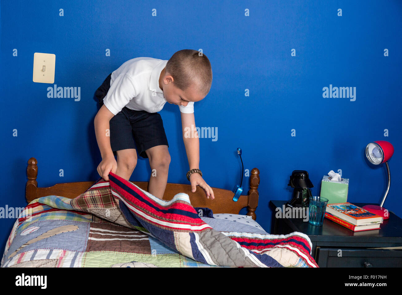 Young Boy (Seven Years Old) Making His Bed in the Morning. MR Stock ...