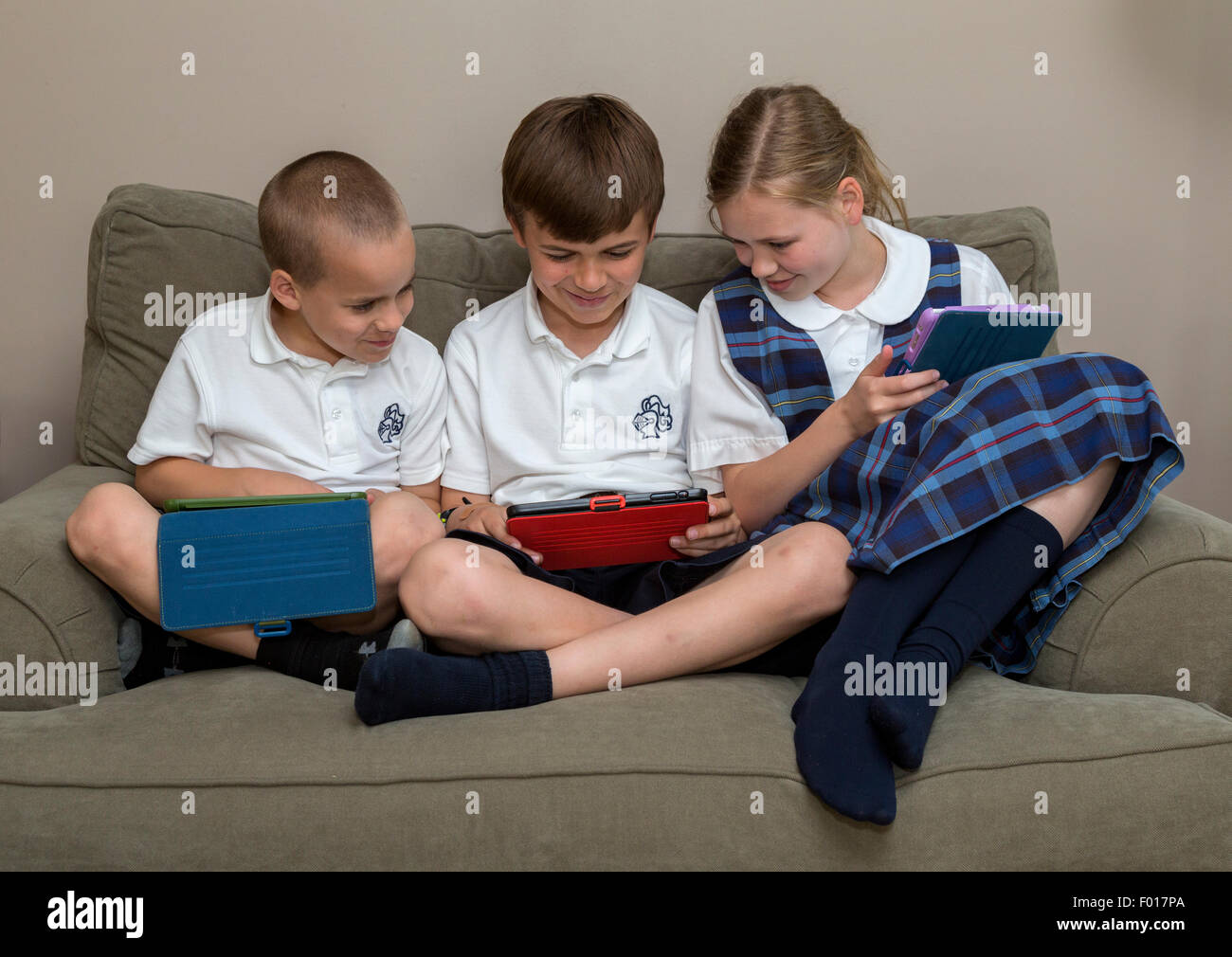 Modern Family at Home after School: Kids with their iPads. MR Stock ...
