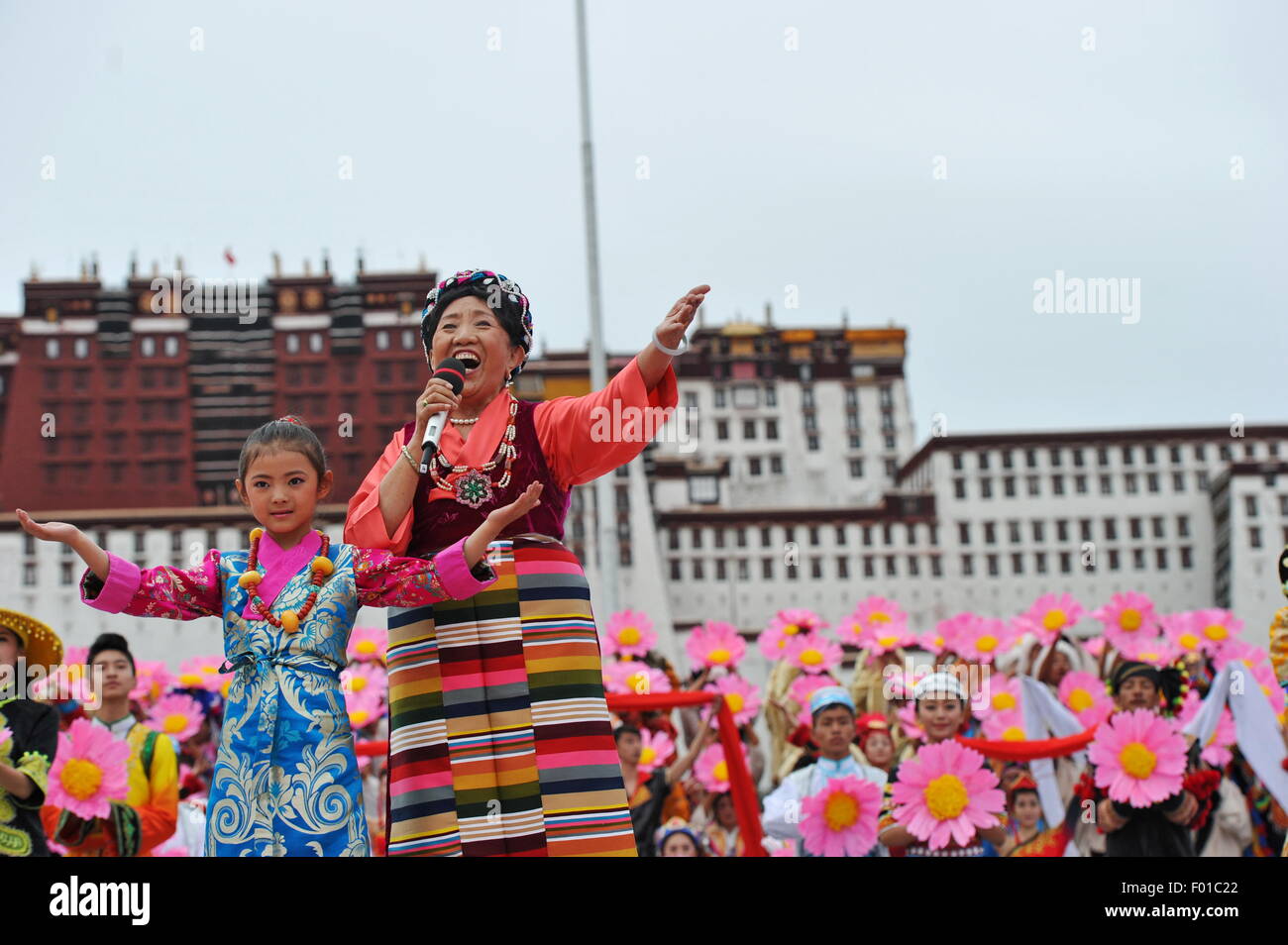Lhasa. 6th Aug, 2015. Tibetan singers sing at the Potala Palace Square ...