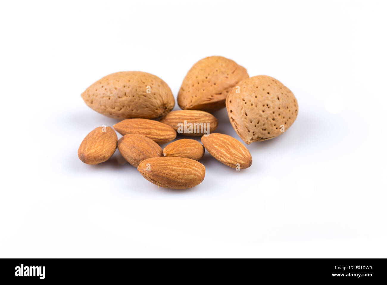 Dried almonds isolated on a white background Stock Photo - Alamy