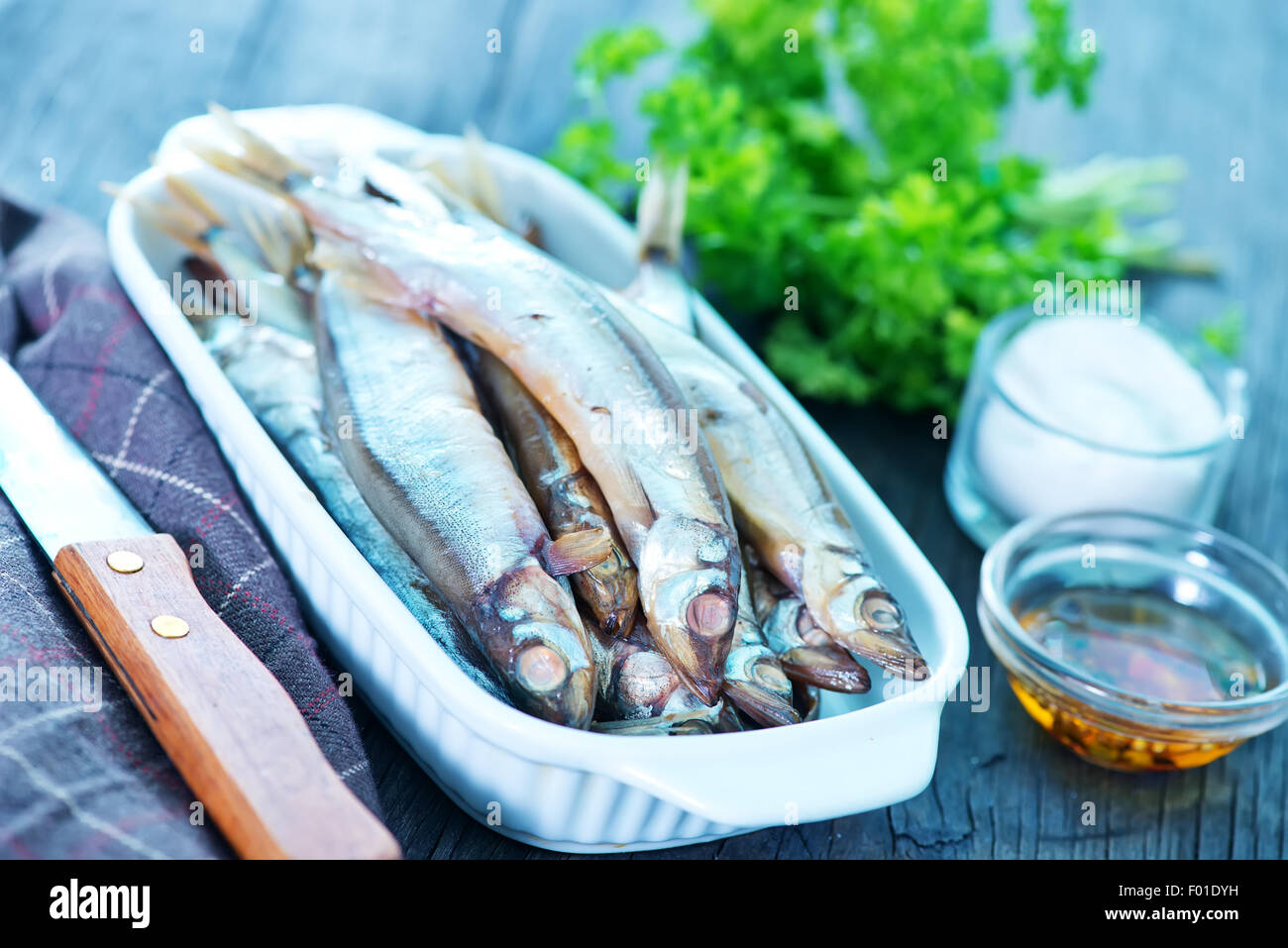 smoked fish with spice on a table Stock Photo - Alamy