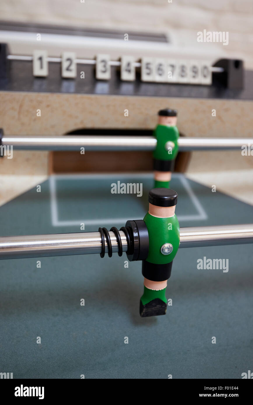 Macro of a foosball table. White character Stock Photo - Alamy