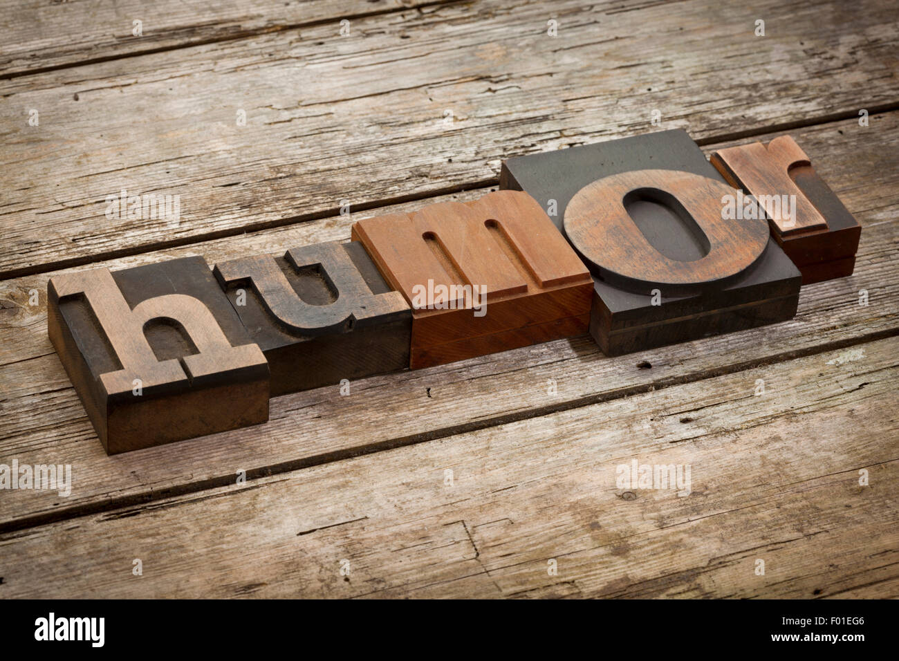 humor, word written with vintage letterpress printing blocks, angled ...