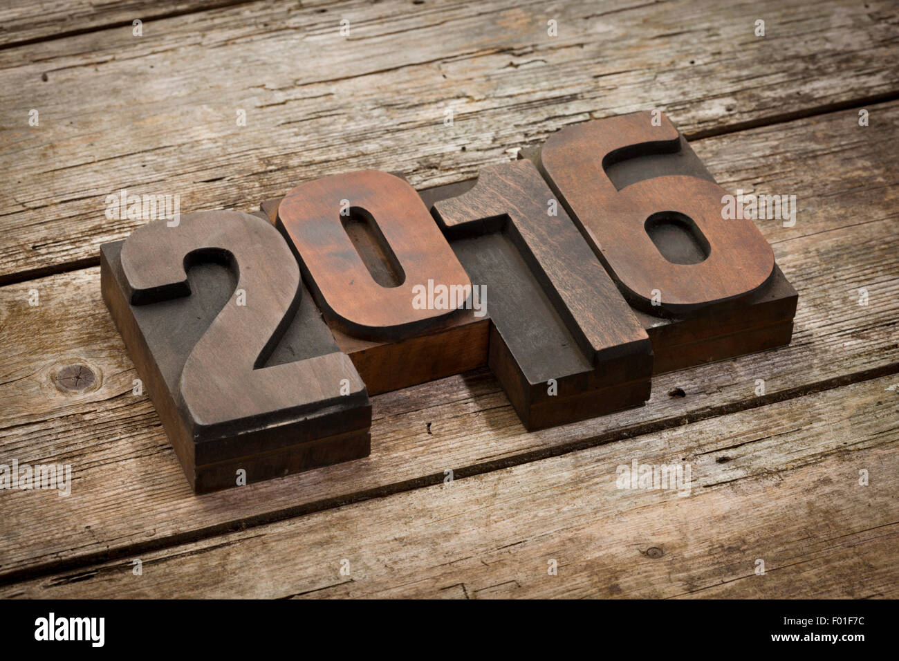 2016, year written with vintage letterpress printing blocks, angled ...