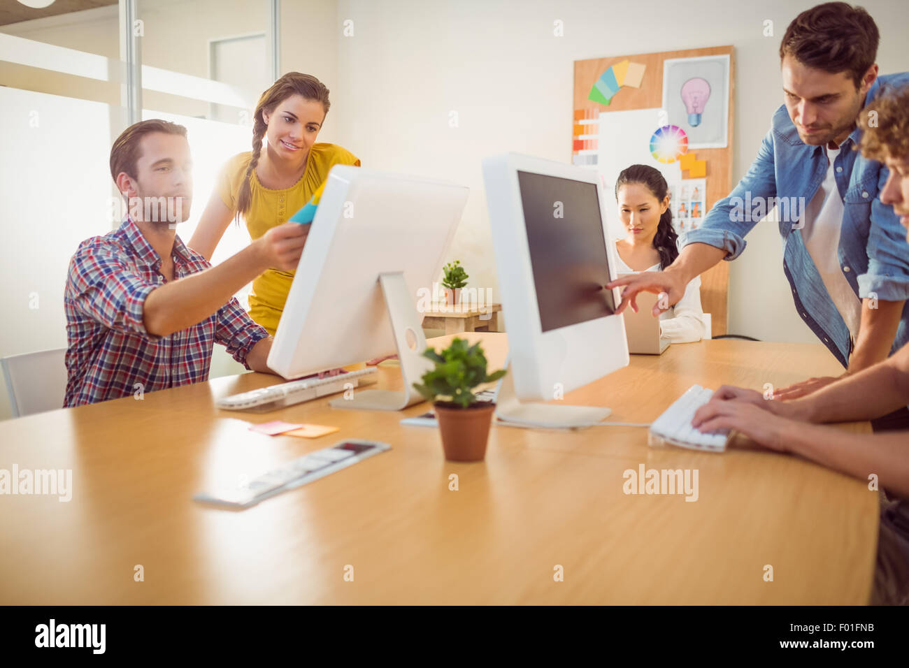 Attentive business team working on laptops Stock Photo - Alamy