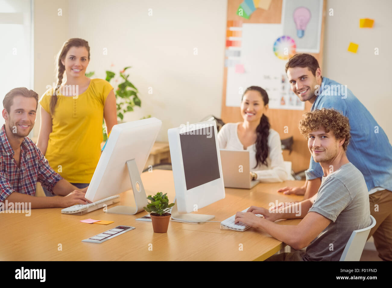 Creative team sitting table laptops hi-res stock photography and images ...