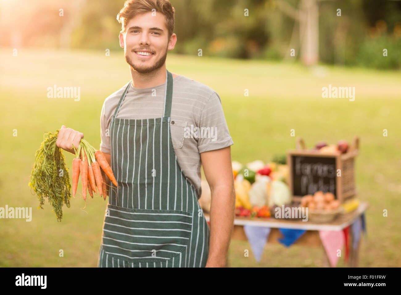 Handsome farmer smiling at camera Stock Photo - Alamy