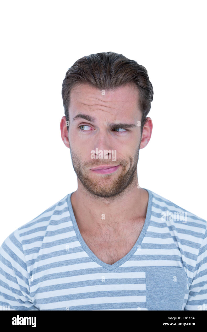 Handsome casual man grimacing in front of camera Stock Photo - Alamy