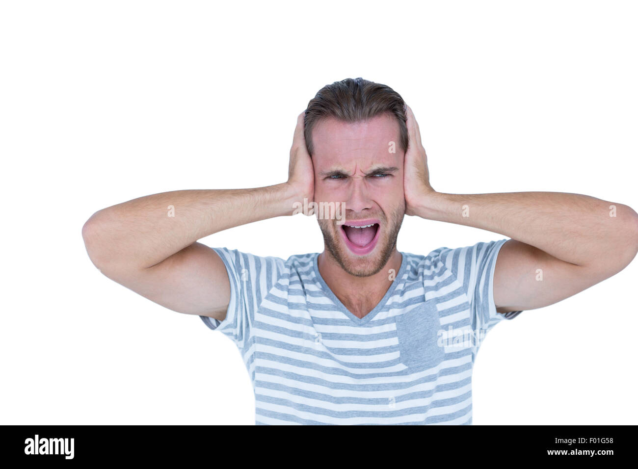 Handsome casual man screaming with hand on ears Stock Photo - Alamy