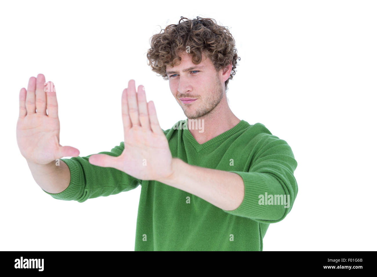 Handsome man looking at his hand Stock Photo - Alamy