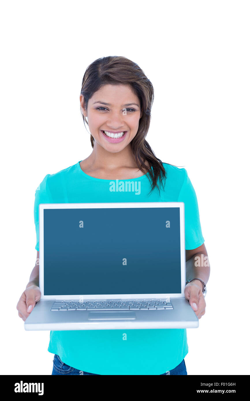 Happy pretty brunette showing laptop computer Stock Photo - Alamy