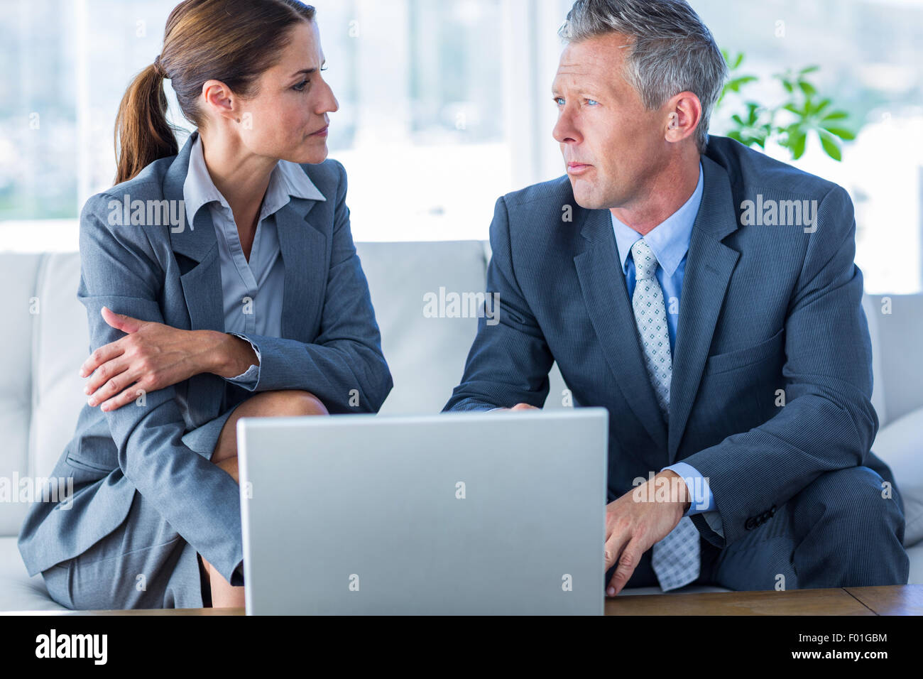 Business people using laptop computer Stock Photo - Alamy