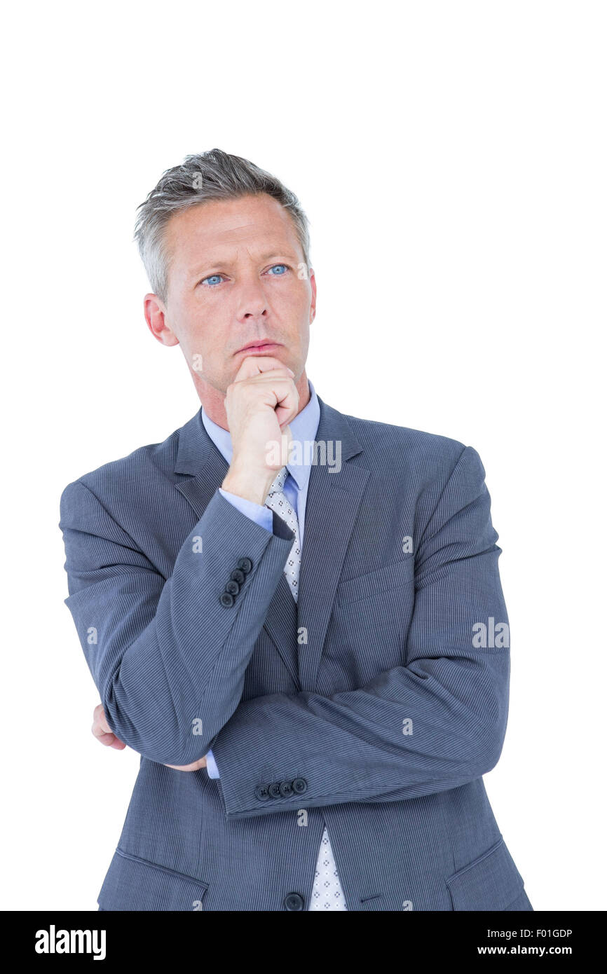Businessman thinking with hand on chin Stock Photo - Alamy