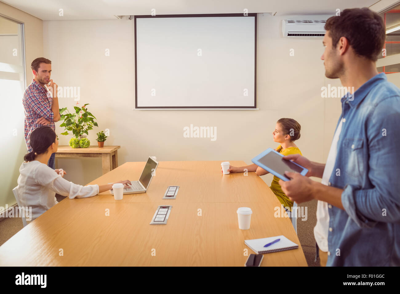 Creative business team making a presentation Stock Photo - Alamy