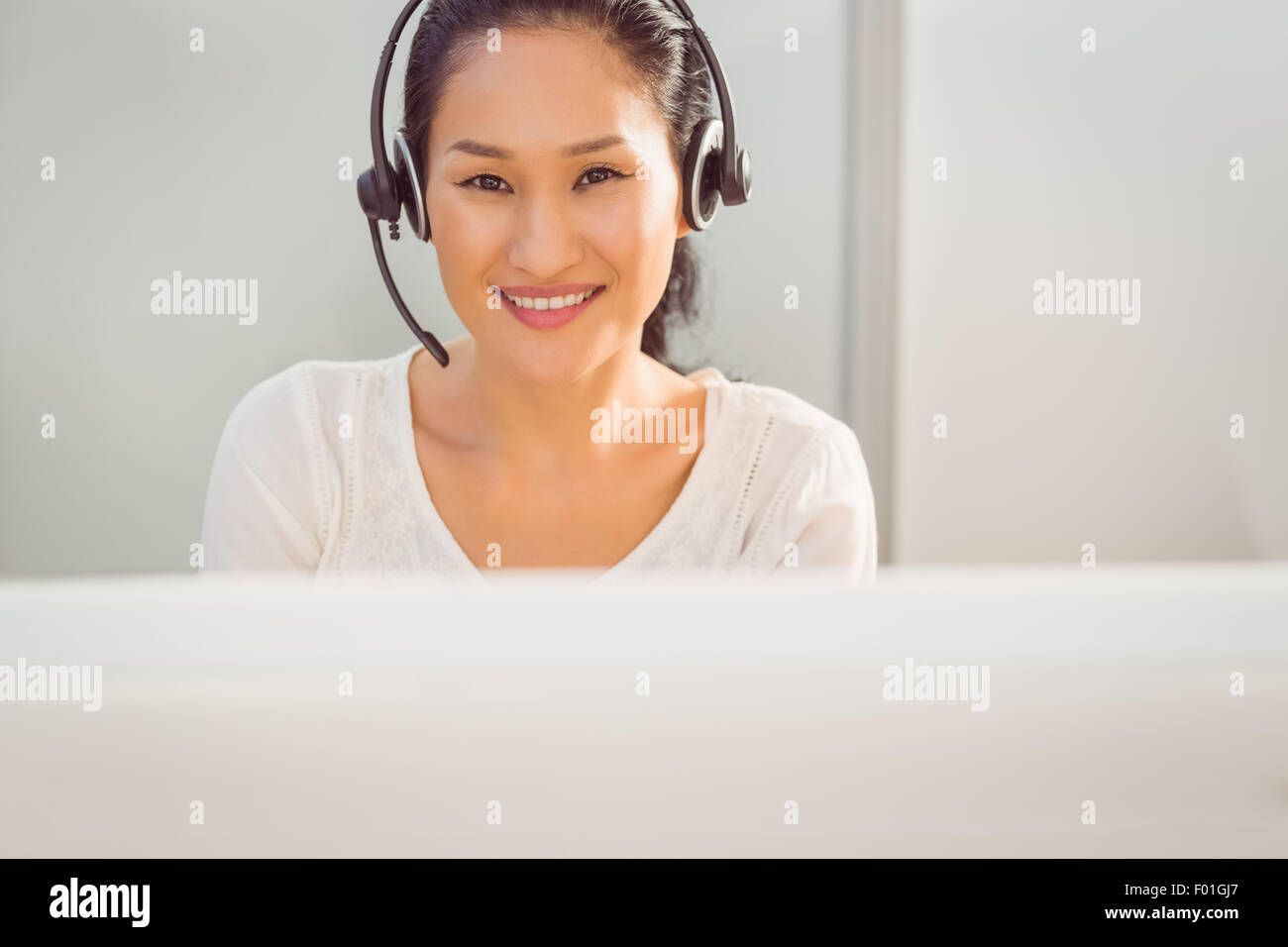 Call centre representative using headset Stock Photo - Alamy