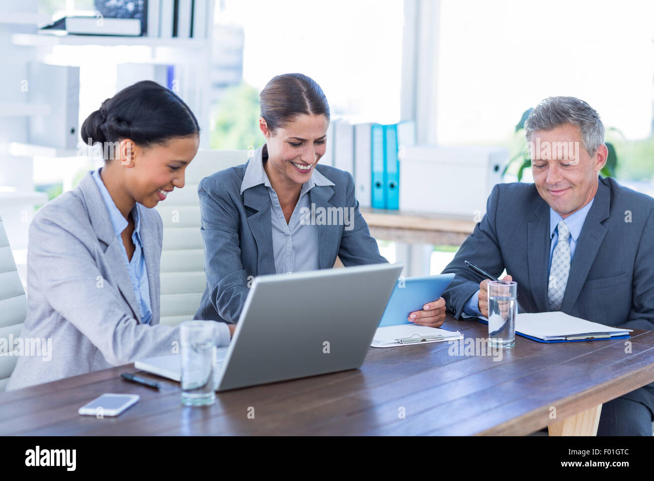 Business people working at desk Stock Photo - Alamy
