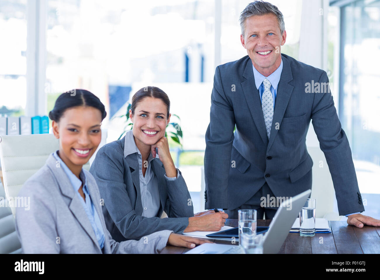 Business people looking at camera Stock Photo - Alamy