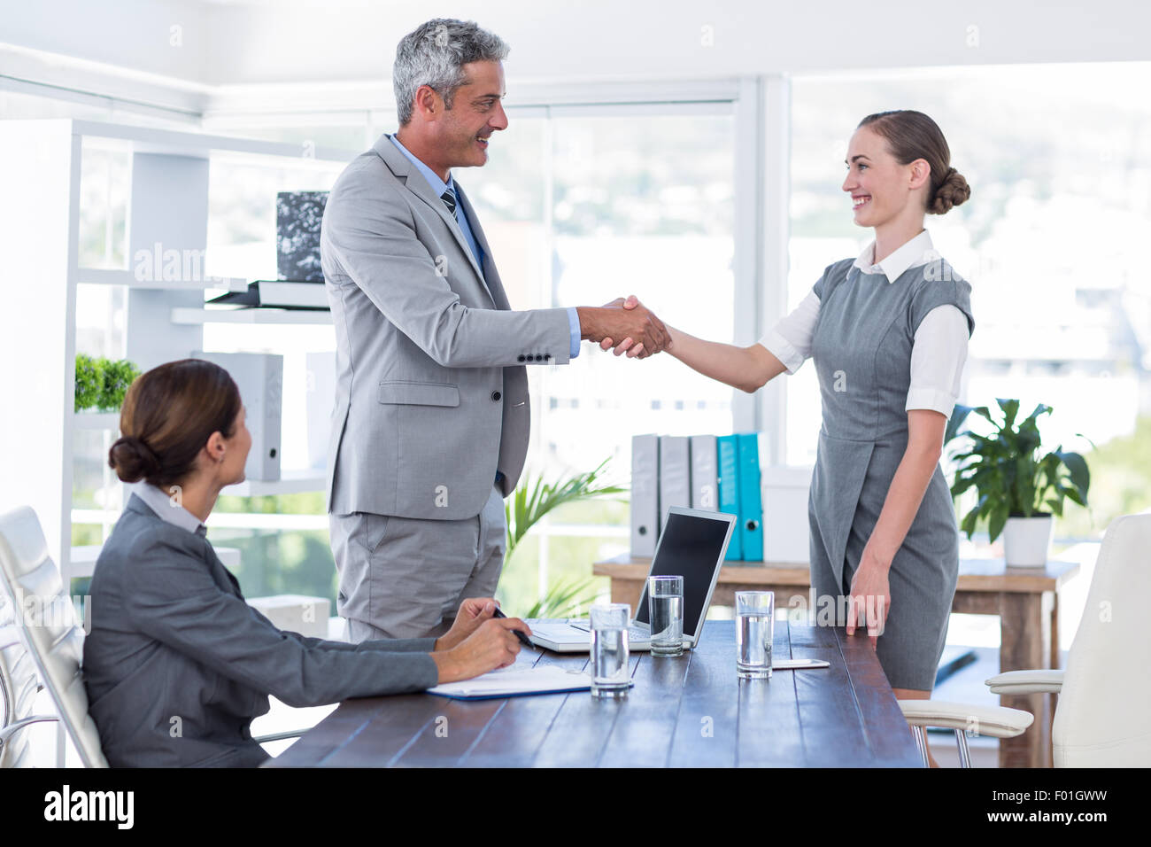 Business people shake hands during interview Stock Photo - Alamy