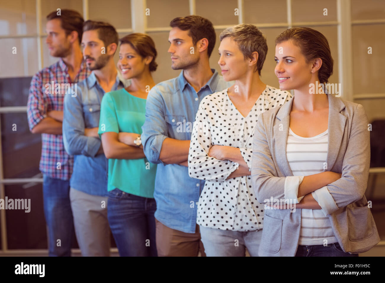 Creative business team looking away Stock Photo - Alamy