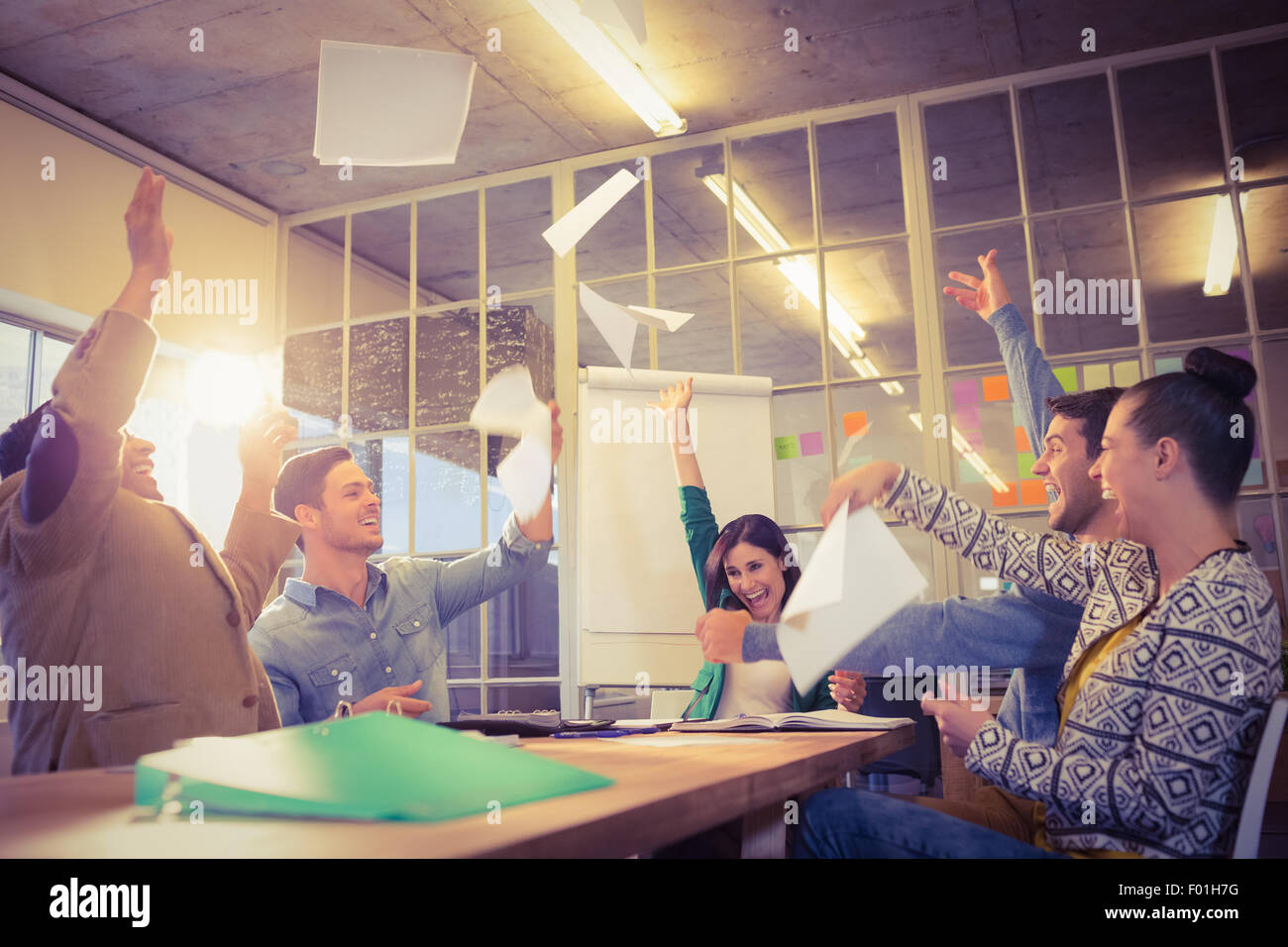 Celebrating business people throwing papers in the air Stock Photo - Alamy