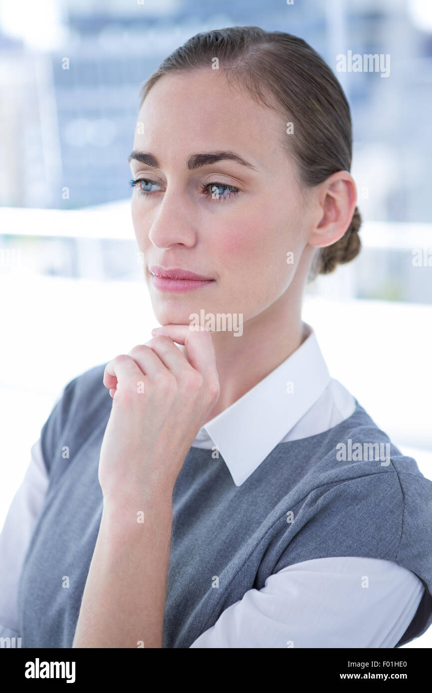 Thinking businesswoman in the office Stock Photo - Alamy