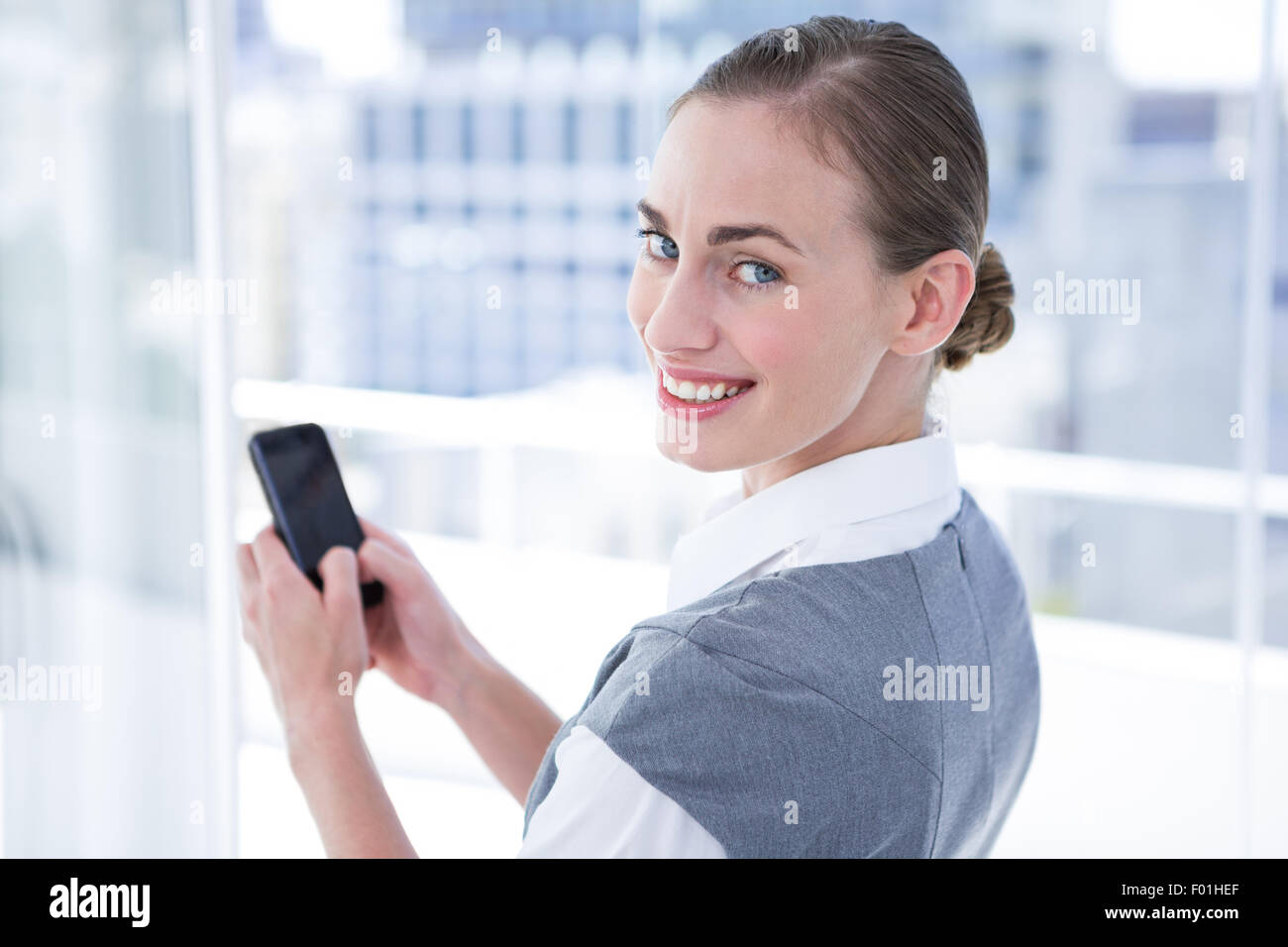 Businesswomen texting with his smartphone Stock Photo - Alamy