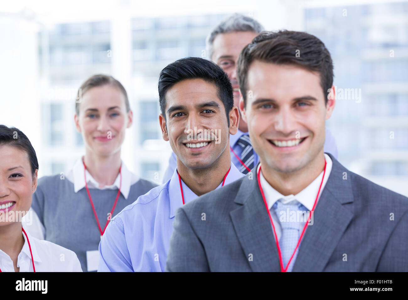 Business colleagues smiling at camera Stock Photo - Alamy