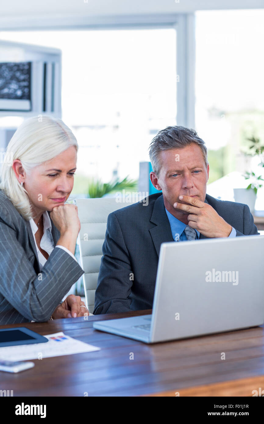 Business people working on laptop computer Stock Photo - Alamy