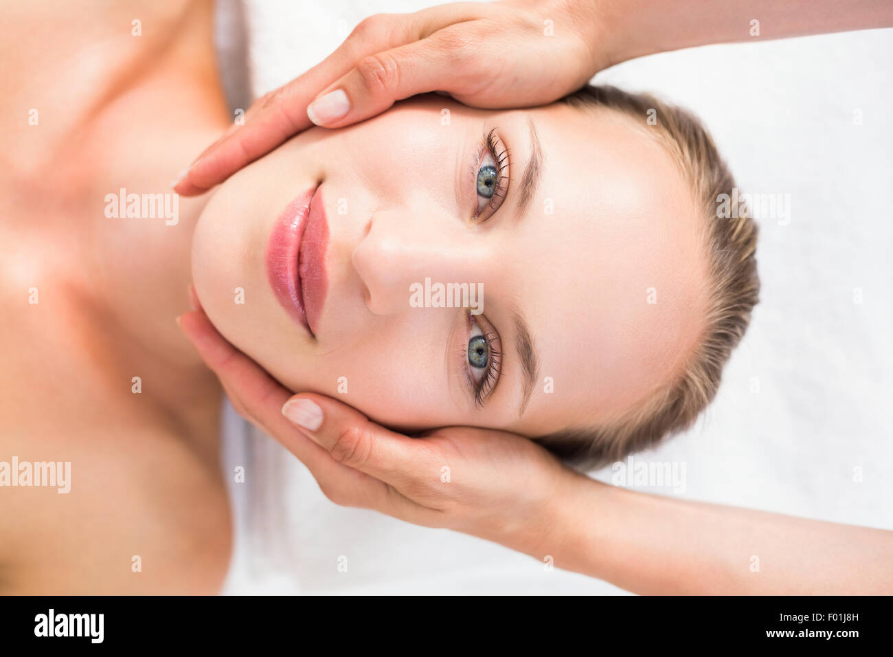pretty blonde receiving head massage Stock Photo - Alamy