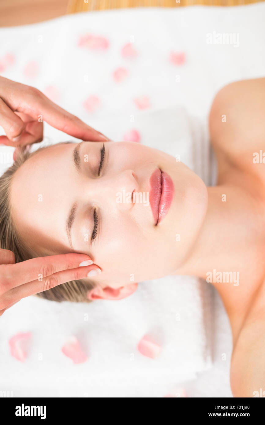 pretty blonde receiving head massage Stock Photo - Alamy