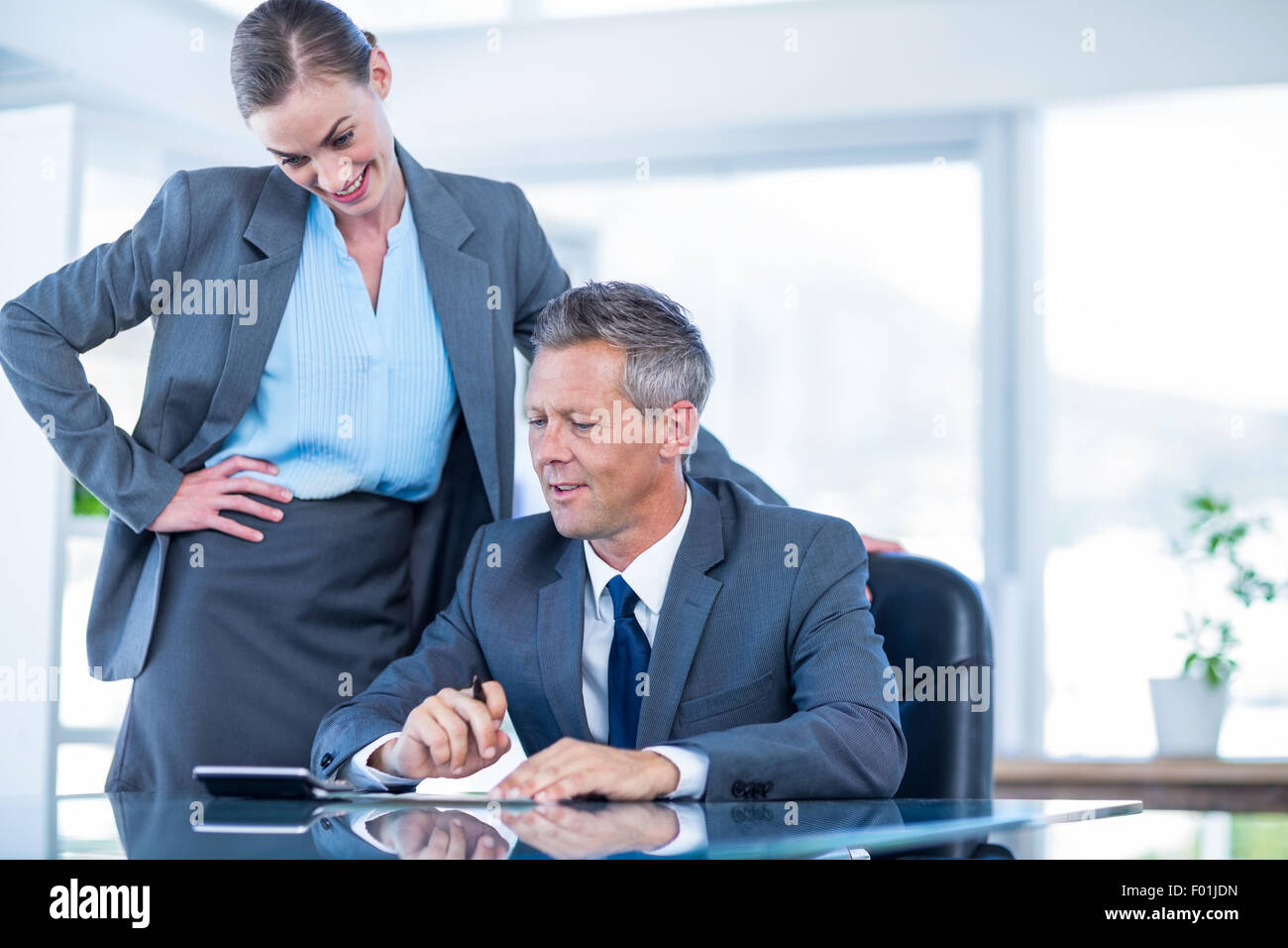 Serious business people working together Stock Photo - Alamy
