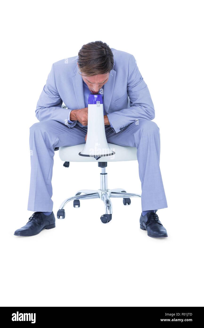 Businessman talking through megaphone Stock Photo - Alamy