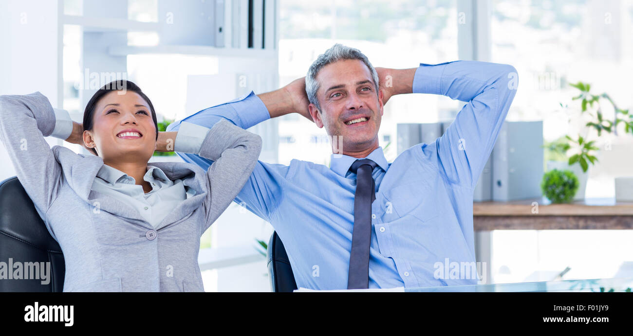 Business people relaxing in swivel chair Stock Photo - Alamy