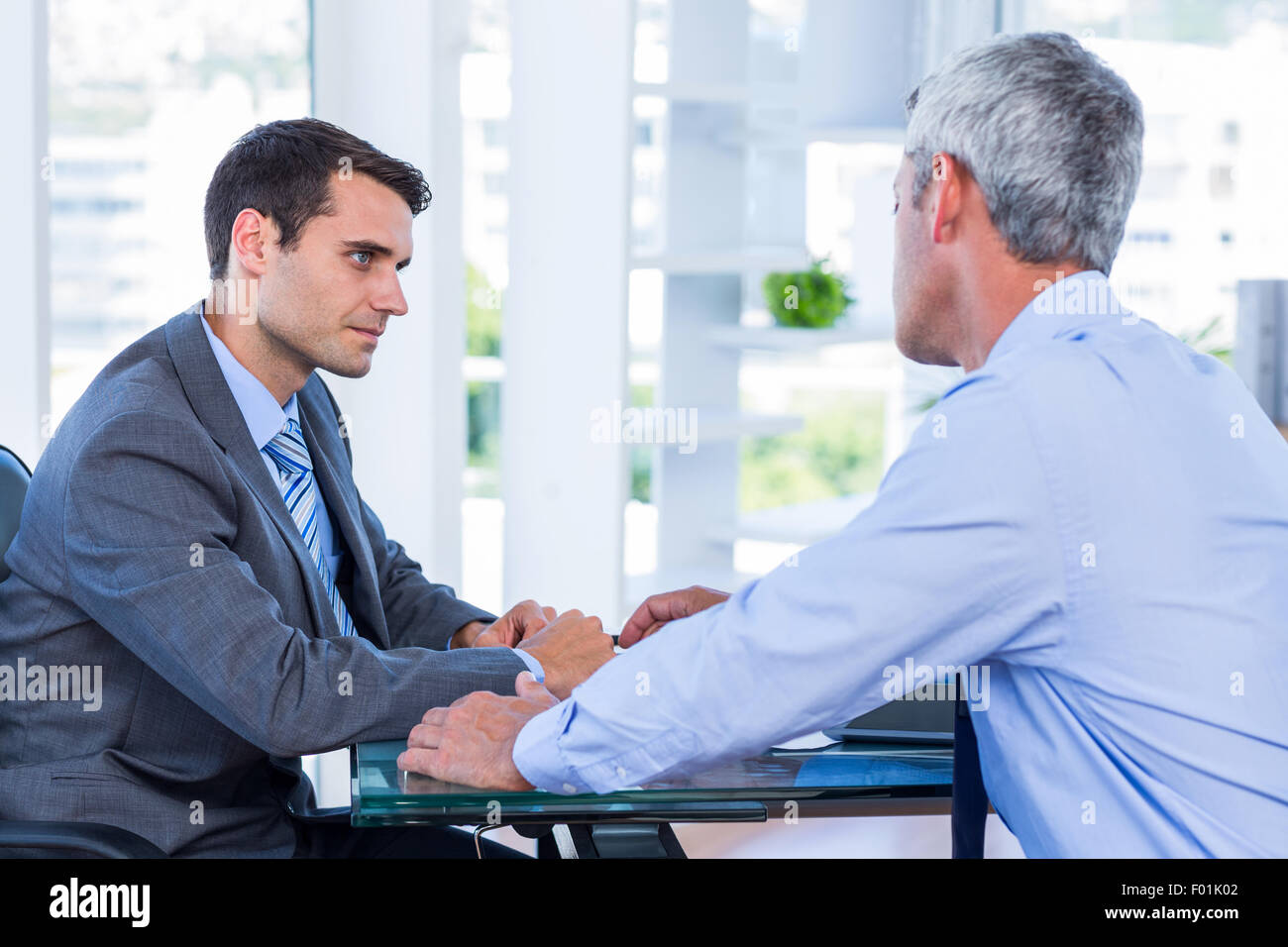 Business people speaking together Stock Photo - Alamy