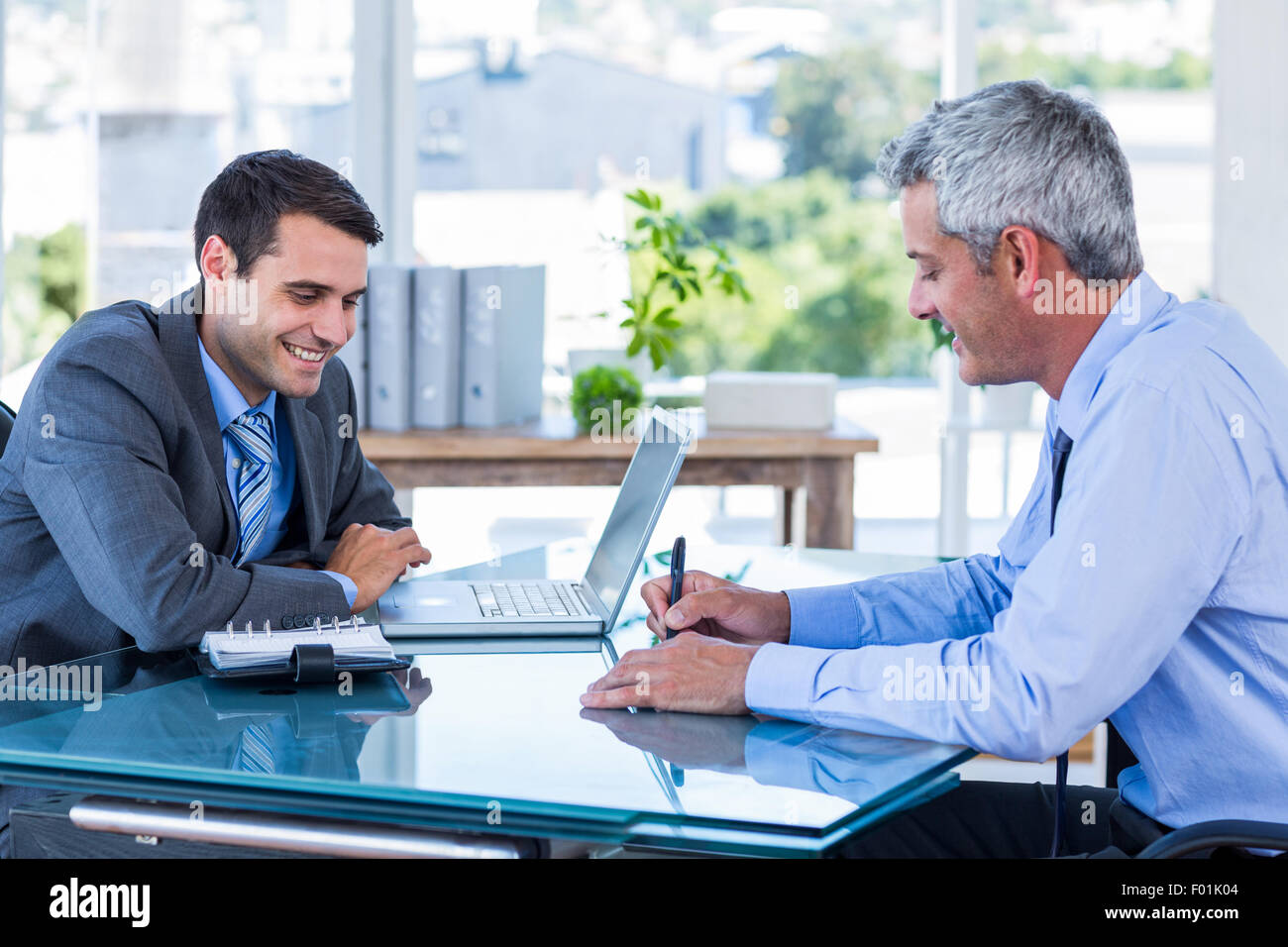 Happy business people working together Stock Photo - Alamy