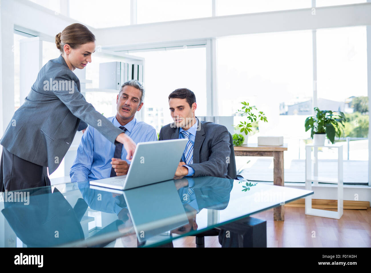 Business people working on laptop computer Stock Photo - Alamy