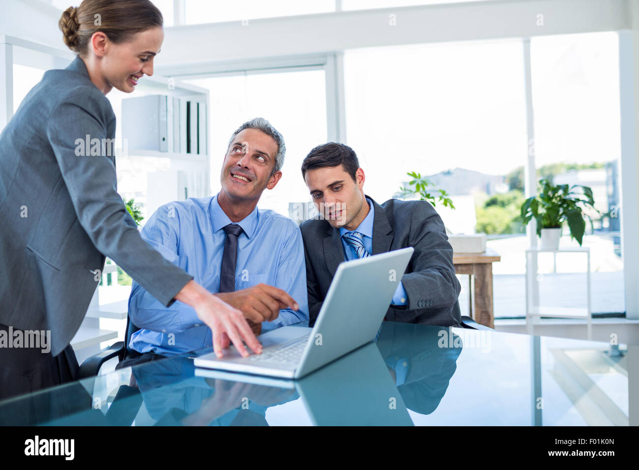 Business people speaking together during meeting Stock Photo - Alamy