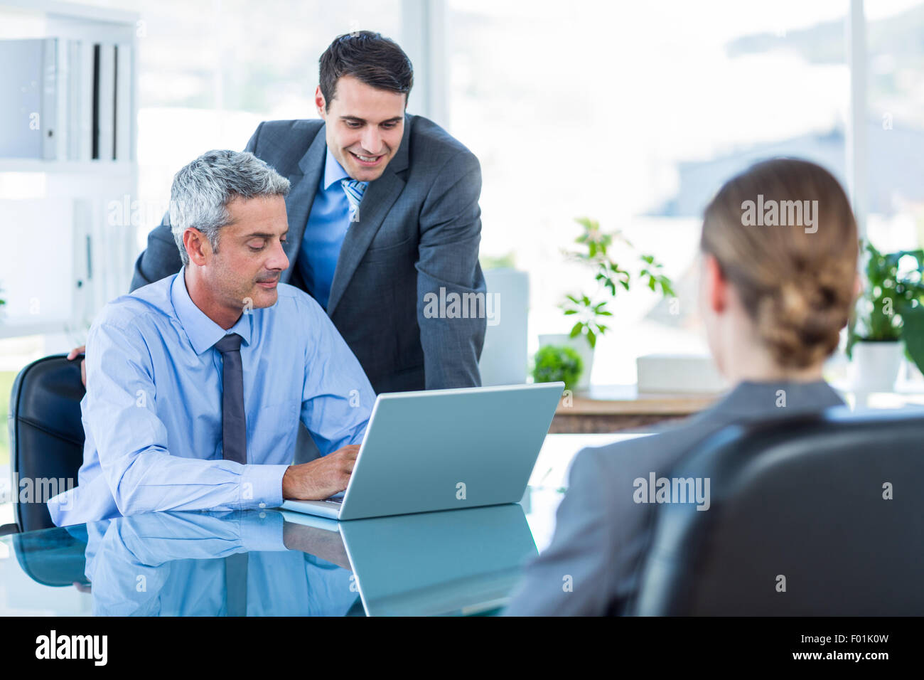 Business people speaking together during meeting Stock Photo - Alamy